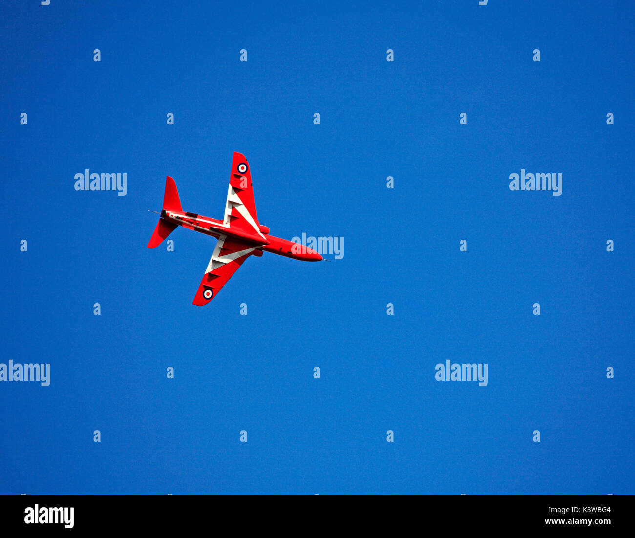 A single Red Arrow from the Royal Air Force Aerobatic Team breaking and ...