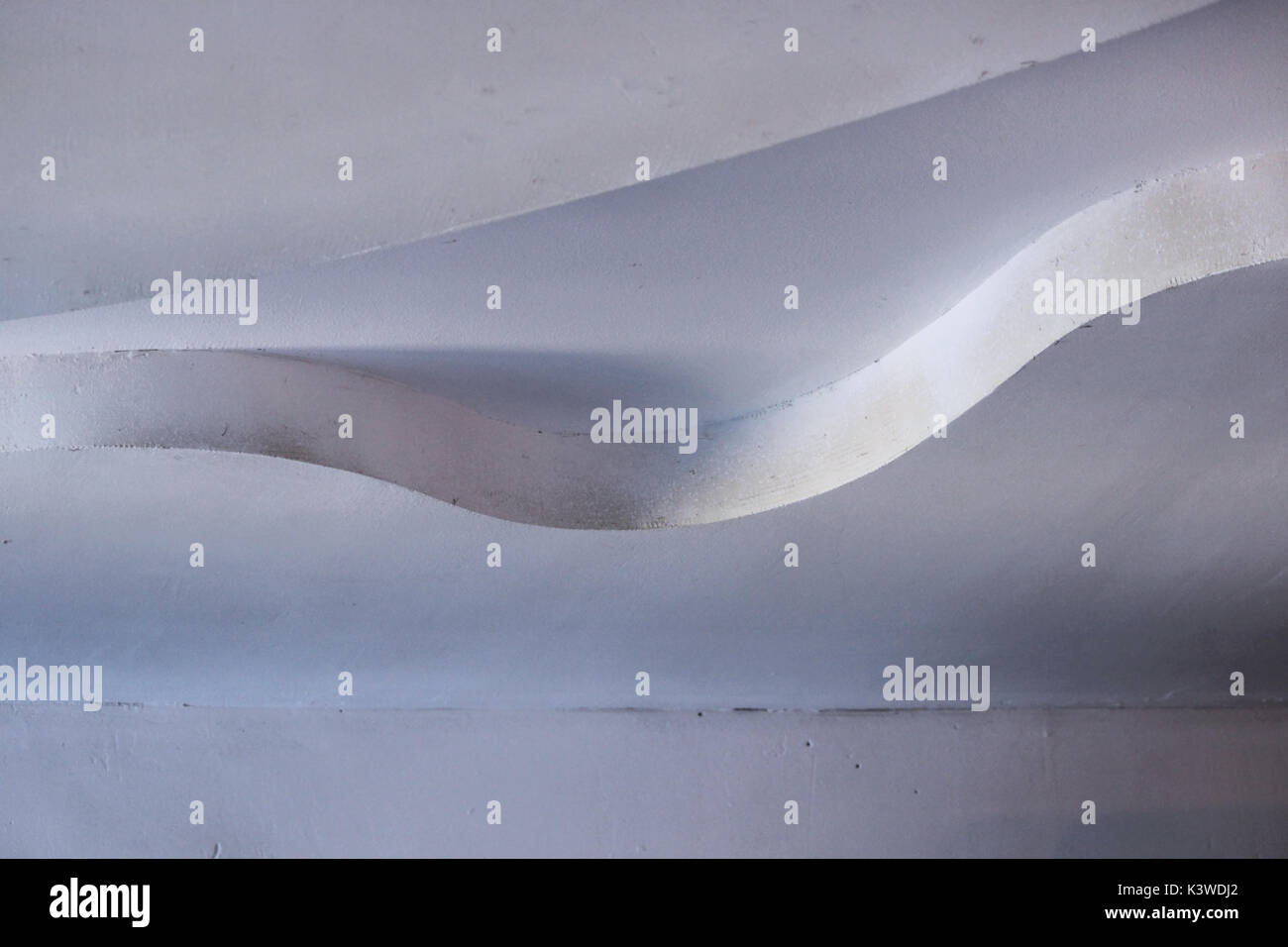 white abstract bend of plasterboard on the ceiling. inversion, computer ...