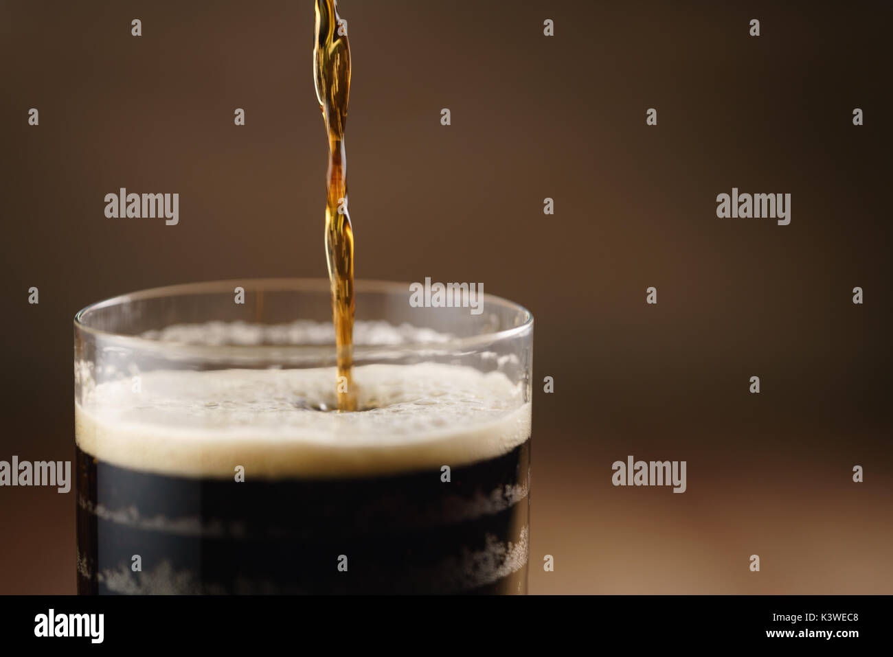 Pouring fresh beer in glass hi-res stock photography and images - Alamy