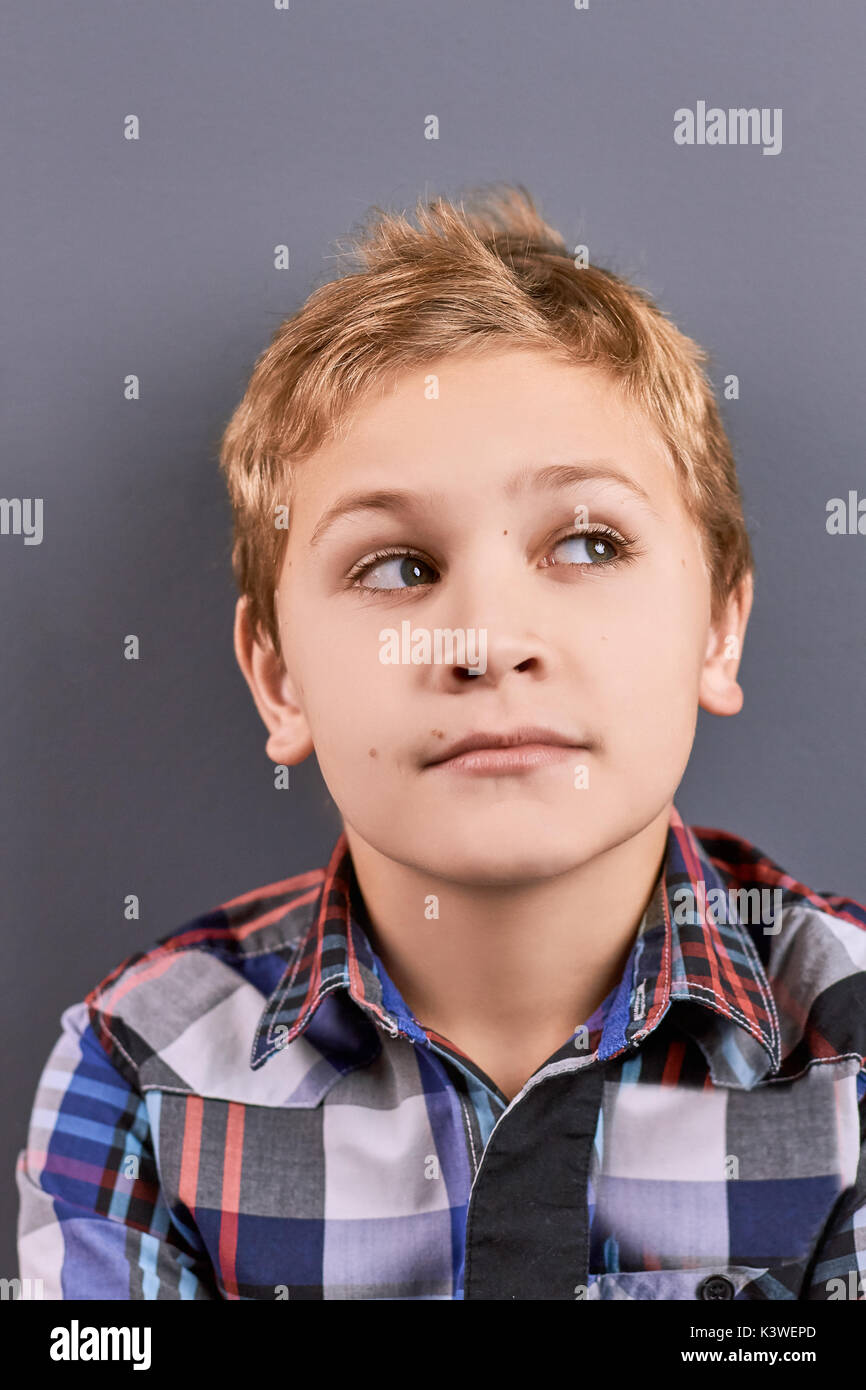 Portrait of handsome little thinking boy. Portrait of a beautiful ...