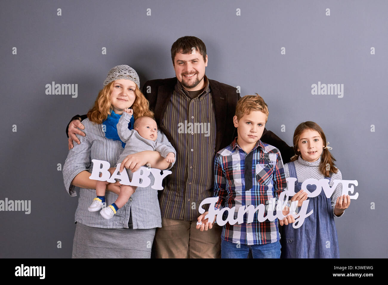 Portrait of happy multi-child family. Studio shot of beautiful happy ...