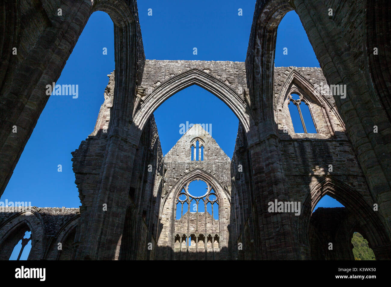 The ruined arched windows of Tintern Abbey, Monmouthshire, Wales Stock ...