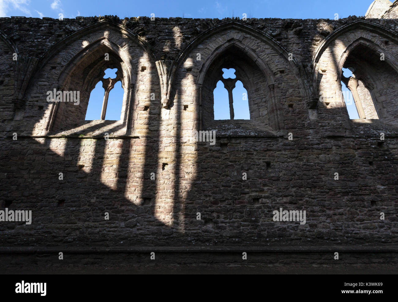 The ruined arched windows of Tintern Abbey, Monmouthshire, Wales Stock ...