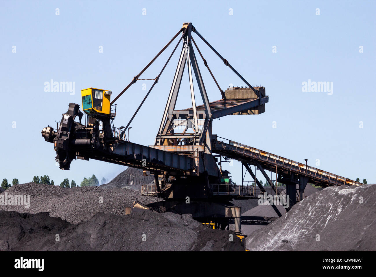 Stacker-reclaimer in a coal handling terminal Stock Photo - Alamy