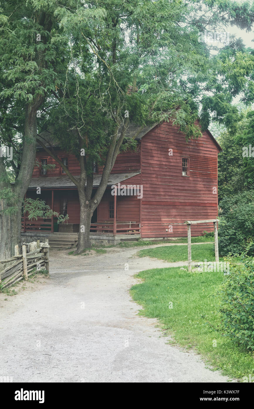 old wooden red cottage in North America Stock Photo - Alamy