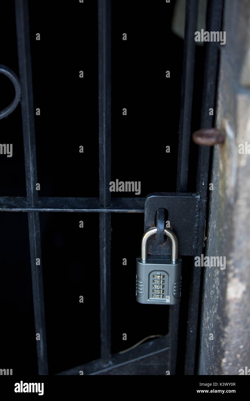 Gate with padlock Stock Photo - Alamy