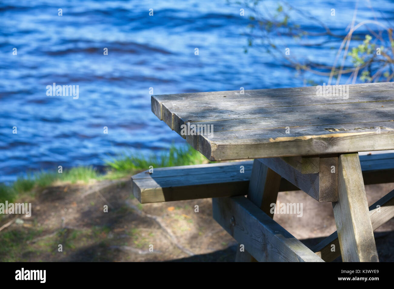 Wooden table by the lake Stock Photo - Alamy