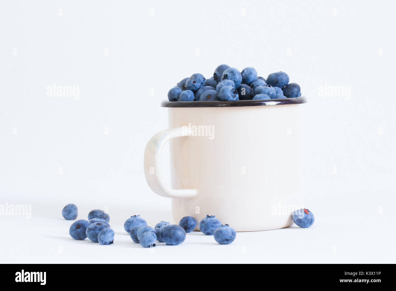 blueberries in cup isolated on white background Stock Photo - Alamy