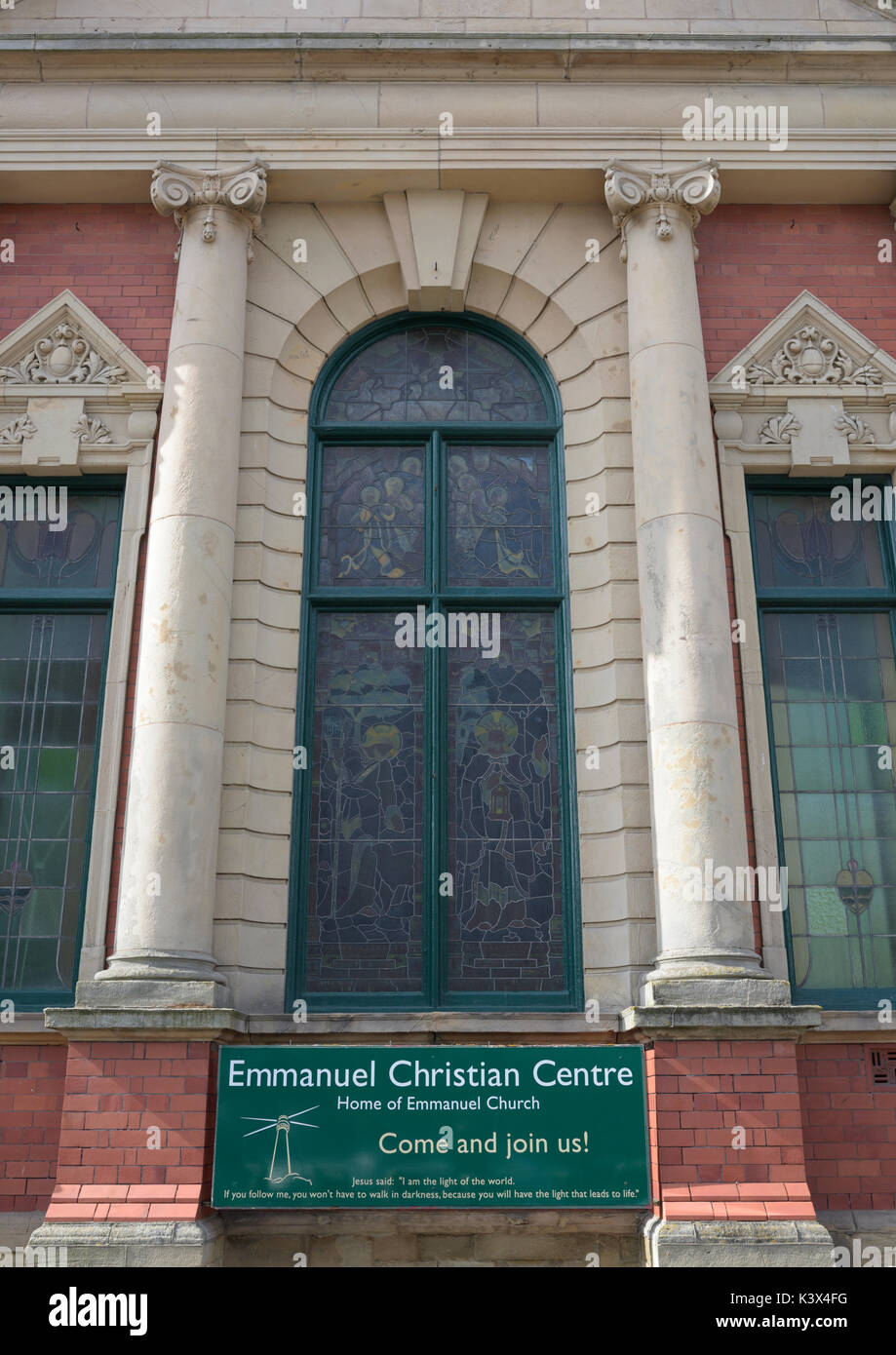 Arched stone window surround and stained glass windows on emmanuel ...