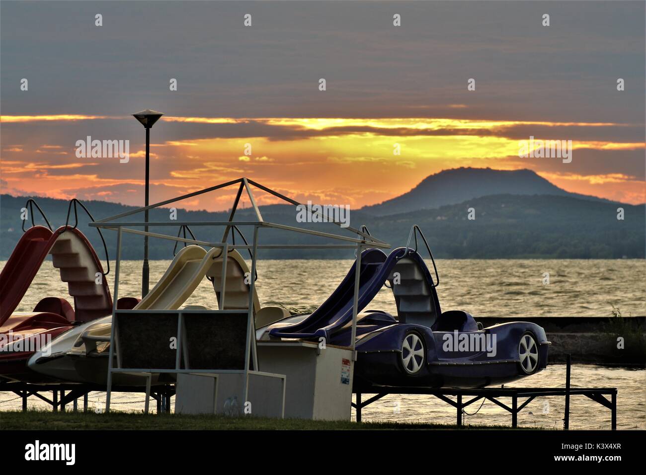 Balaton Sunset Water Slide and Mountain Stock Photo - Alamy