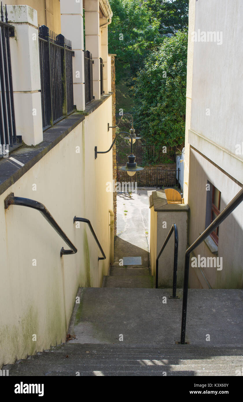 Steps down between two buildings in Port Erin Stock Photo - Alamy