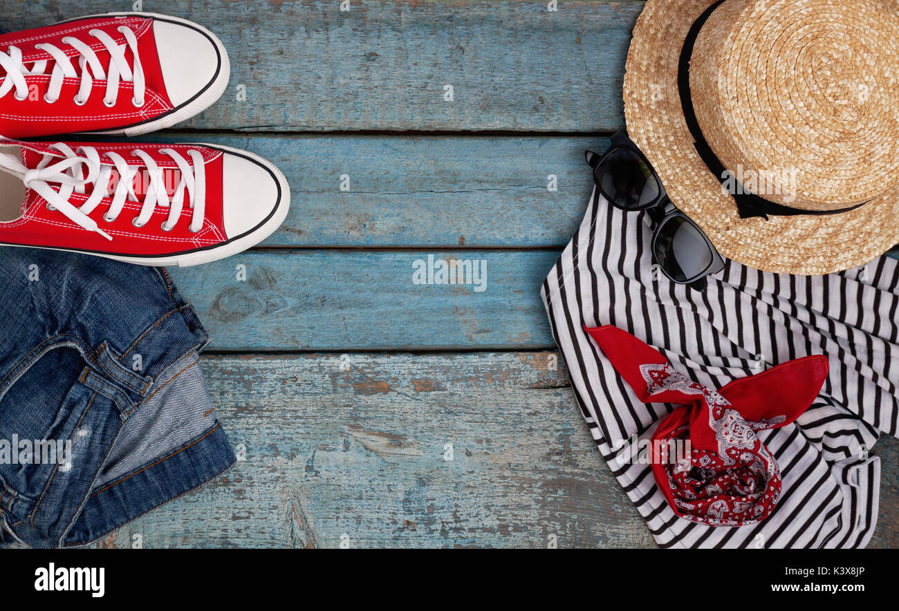 Still life of various items for recreation, clothing, hat, sneakers ...