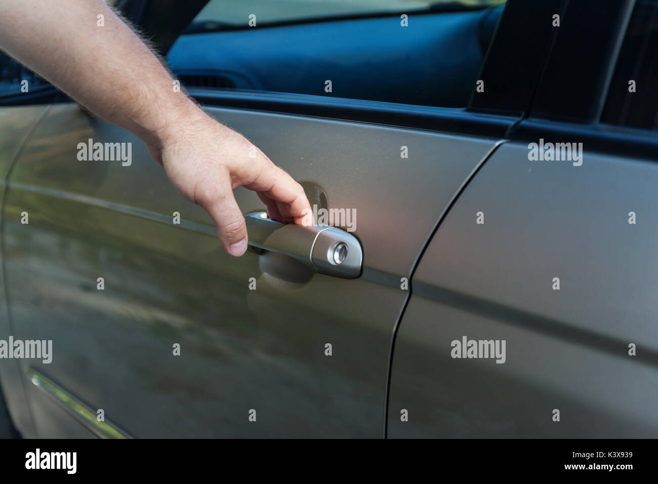 man's hand opens the car door Stock Photo - Alamy