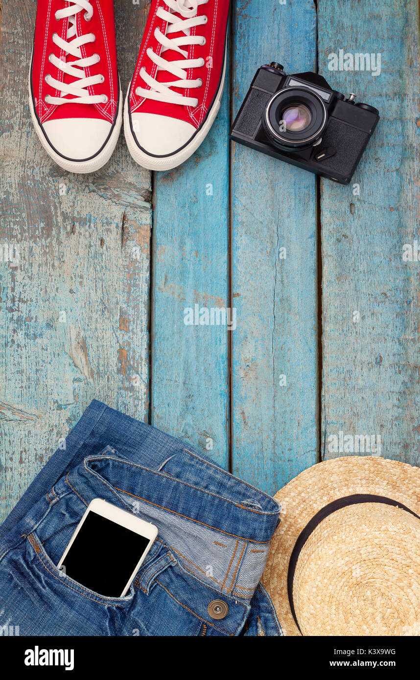 Still life of various items for recreation, clothing, hat, sneakers ...
