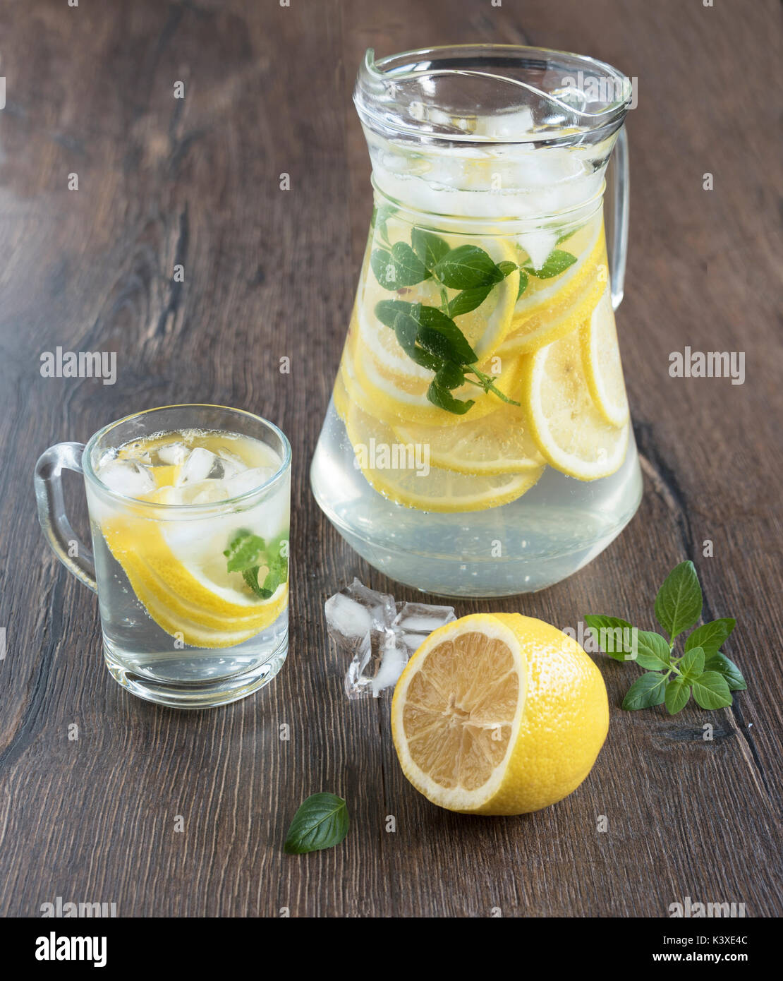 Refreshing drink from lemons with ice Stock Photo - Alamy