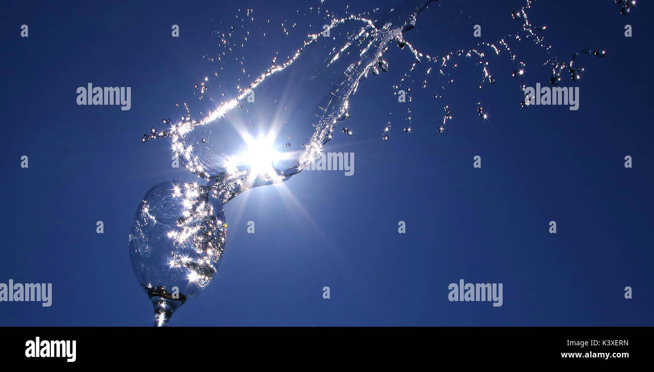 Water splashing from wine glass Stock Photo - Alamy