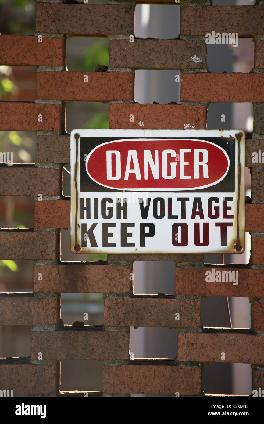 Danger high voltage keep out sign on a red brick wall Stock Photo - Alamy