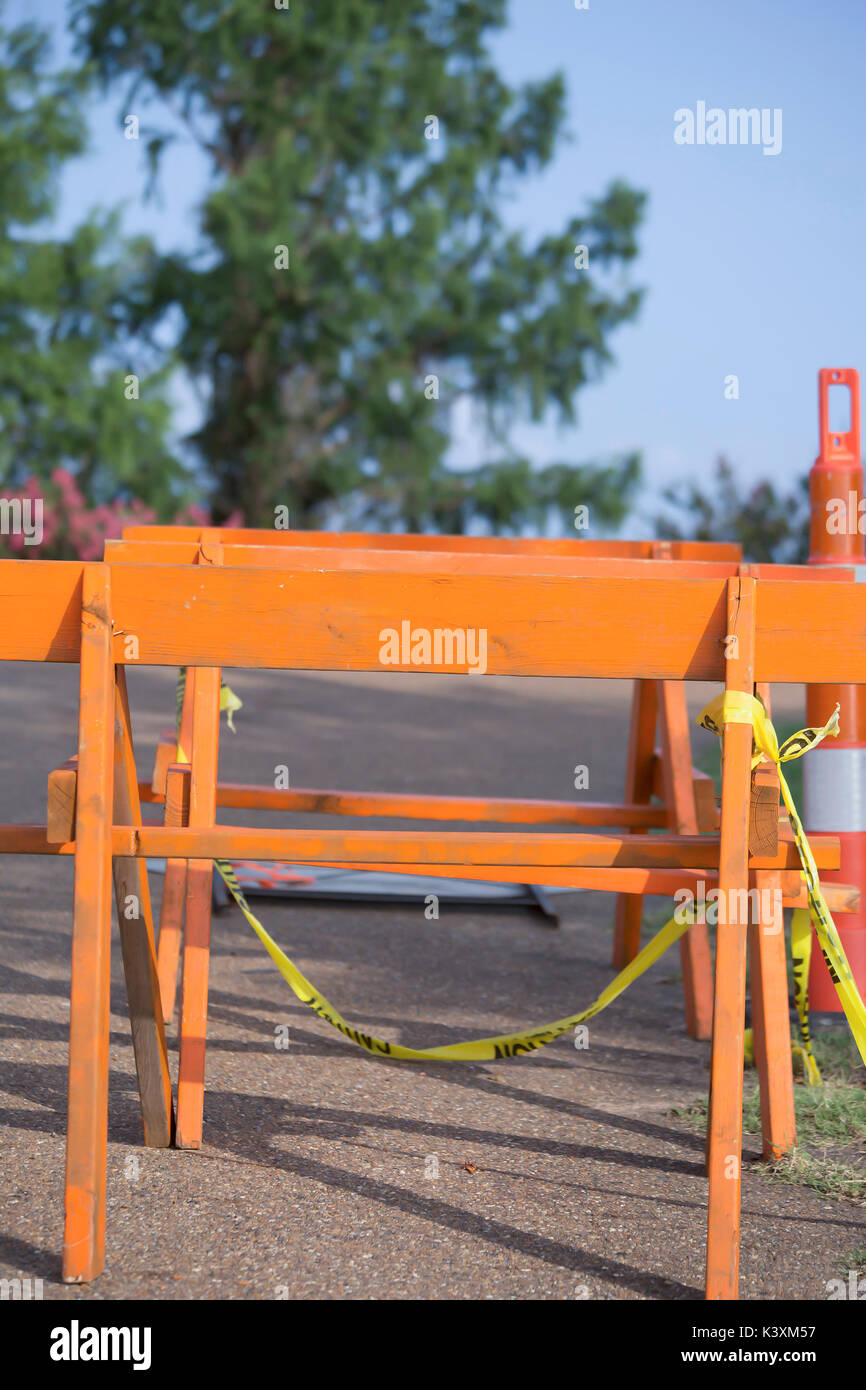 An orange road sign and cone blocking traffic Stock Photo - Alamy