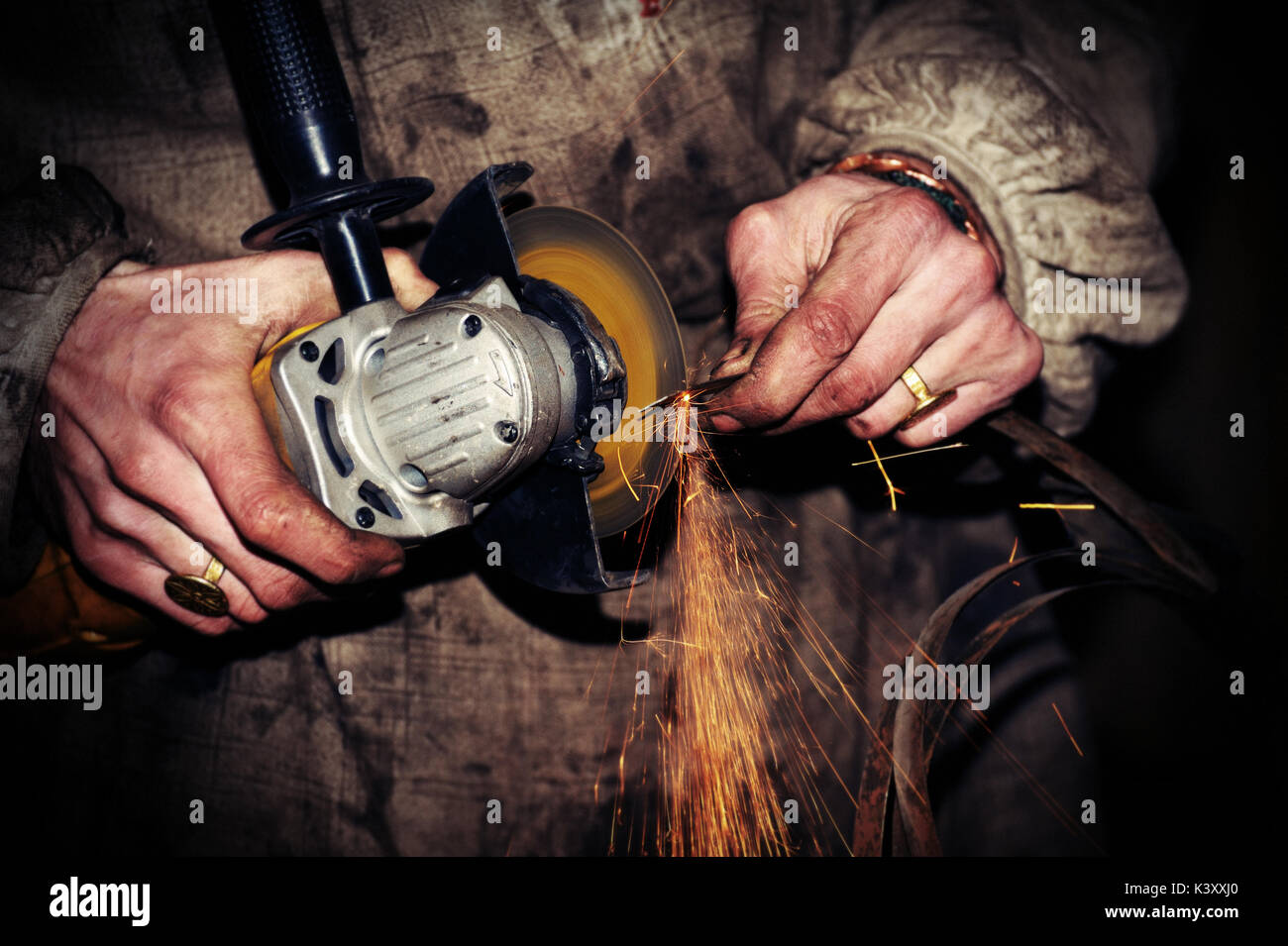 angle grinder in hand working Stock Photo - Alamy