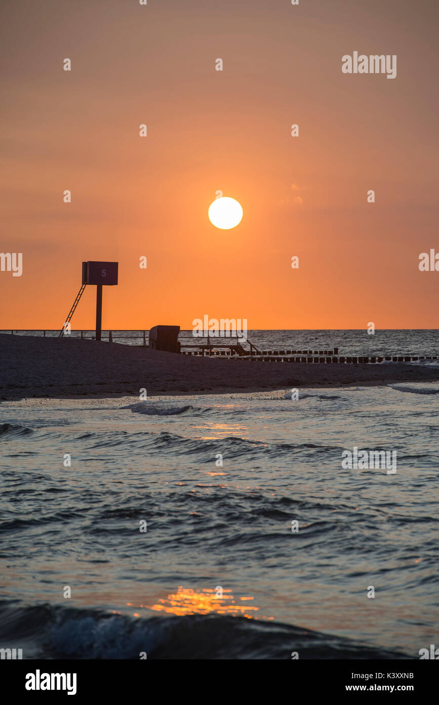 Baltic Sea surf, beach chair and watchtower on sandy beach in front of ...