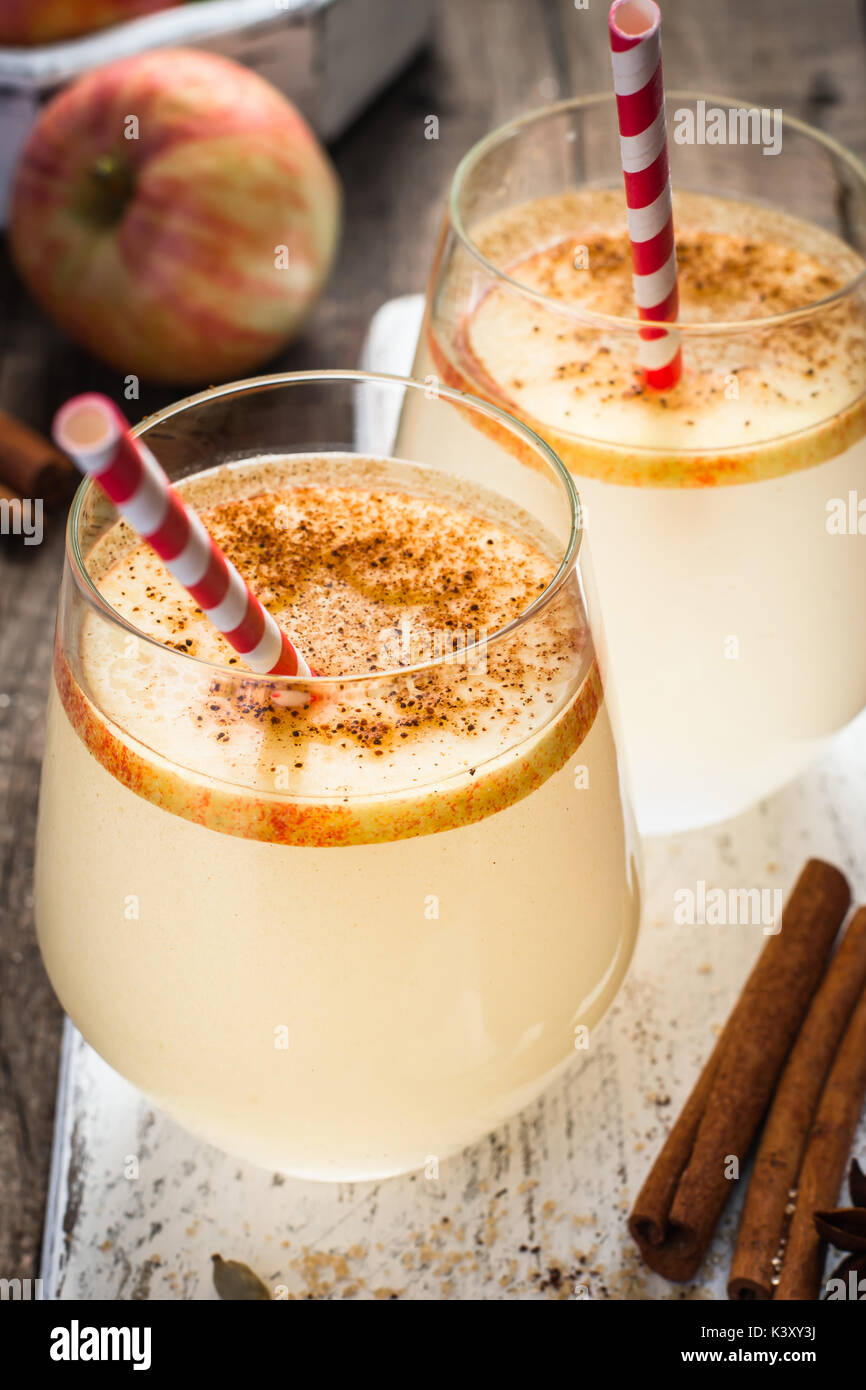 Autumn apple cider cocktail with spices and apple slices. Selective ...