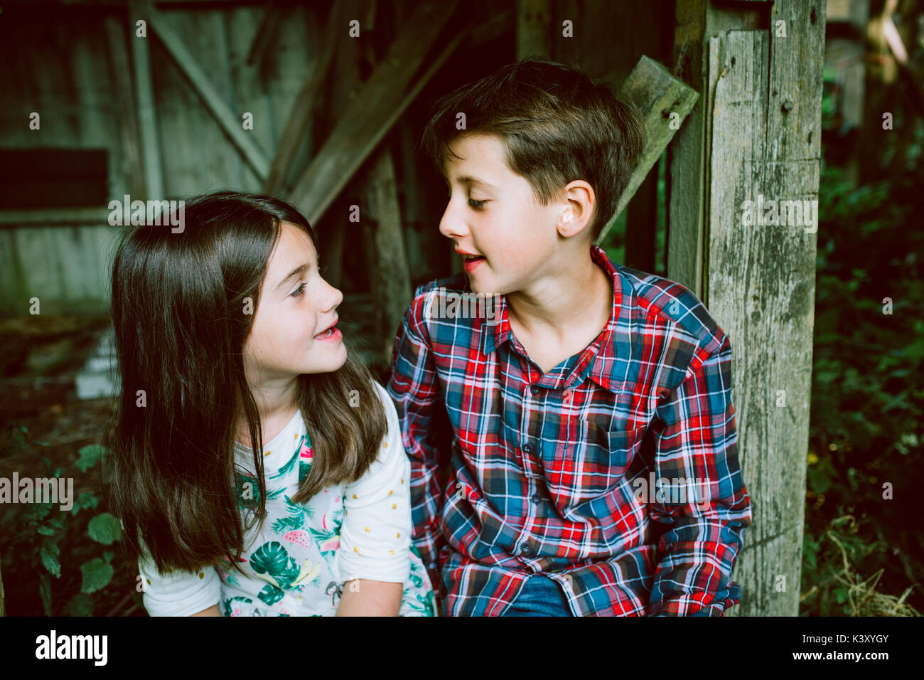 children sat smiling Stock Photo - Alamy