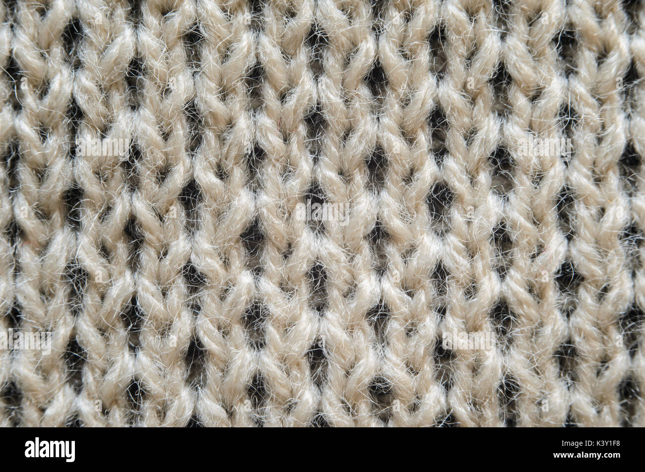 Knitting fabric texture closeup background - beige color Stock Photo ...