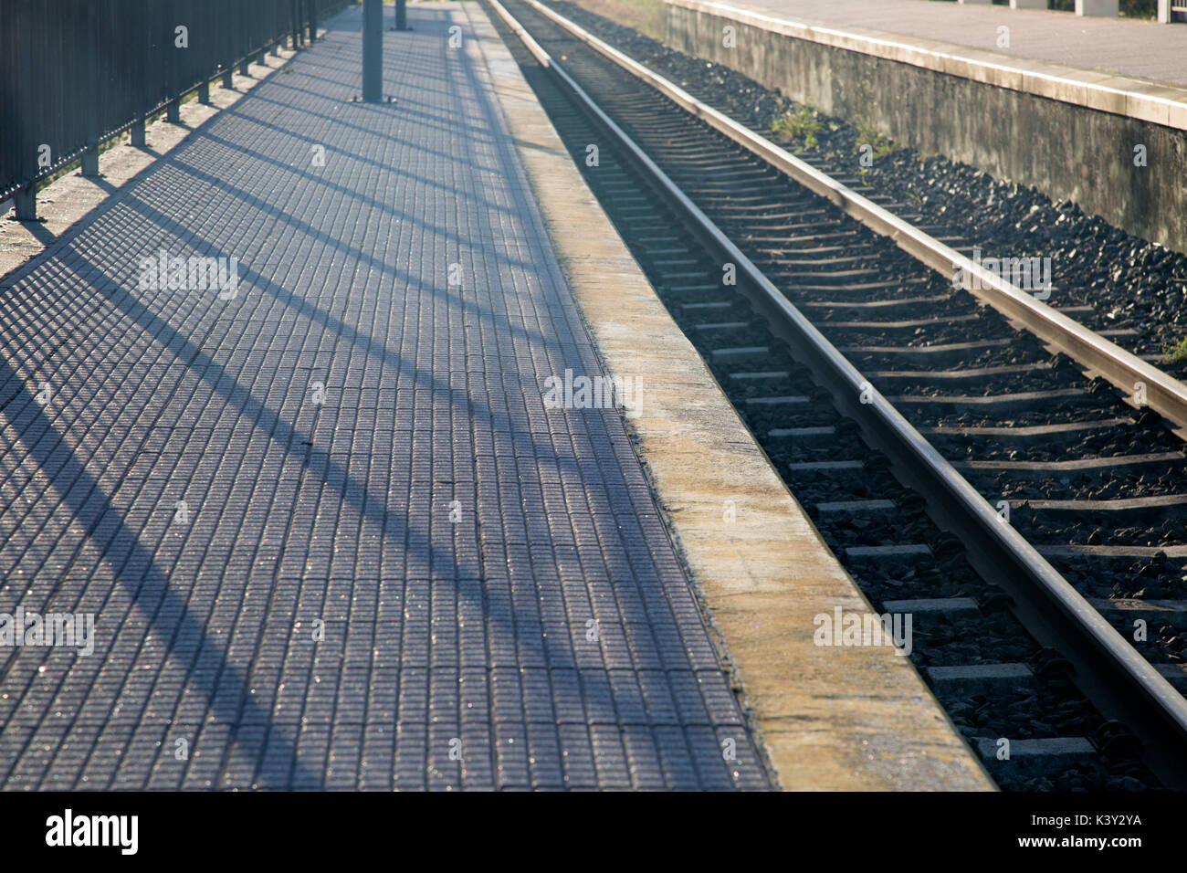 Railway Train Station Platform with Track Stock Photo - Alamy