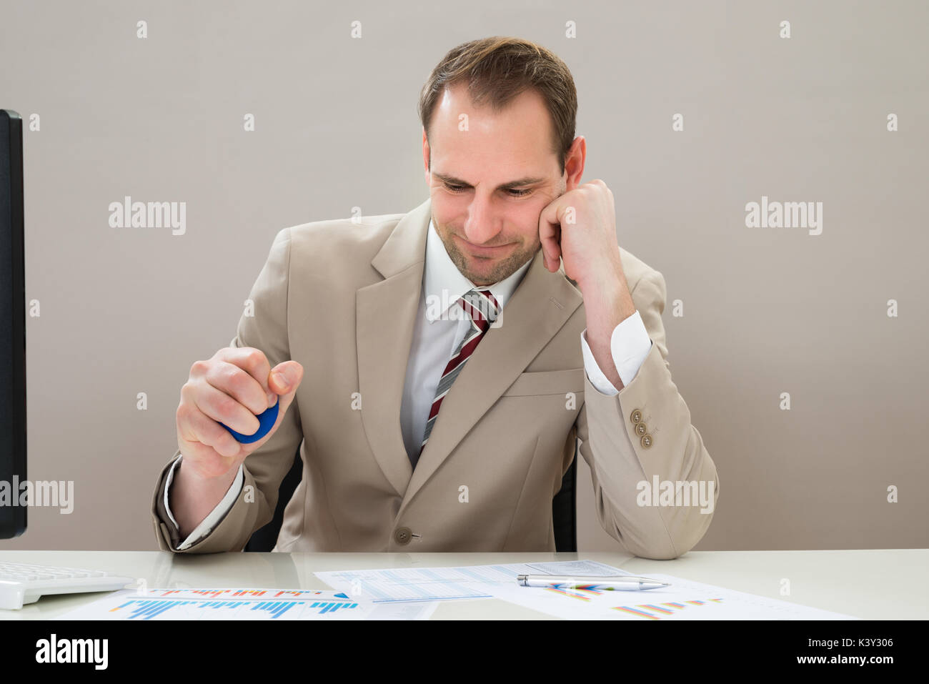 Man squeezing ball desk hi-res stock photography and images - Alamy