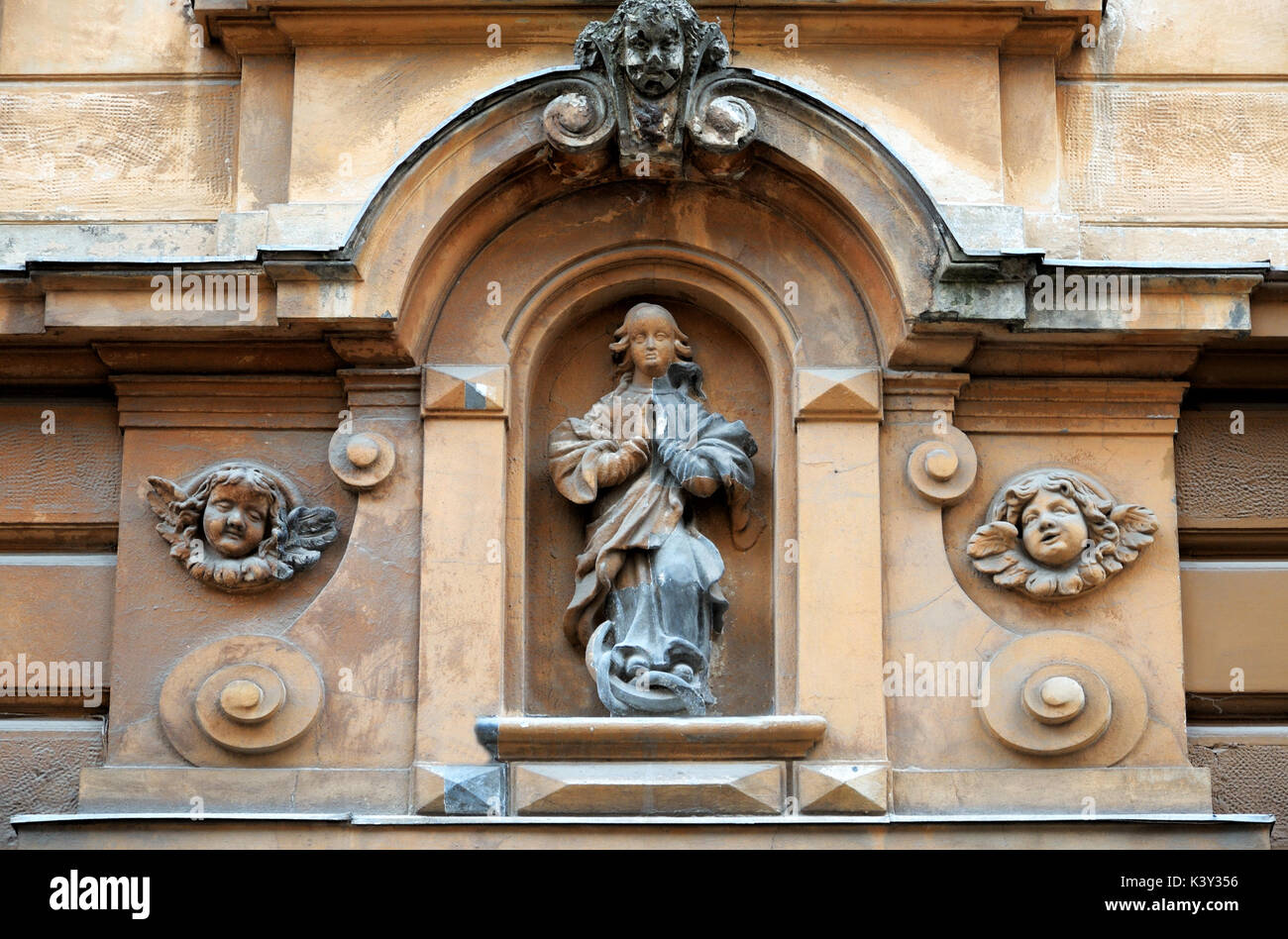 An ancient statue in the wall of the house Stock Photo - Alamy