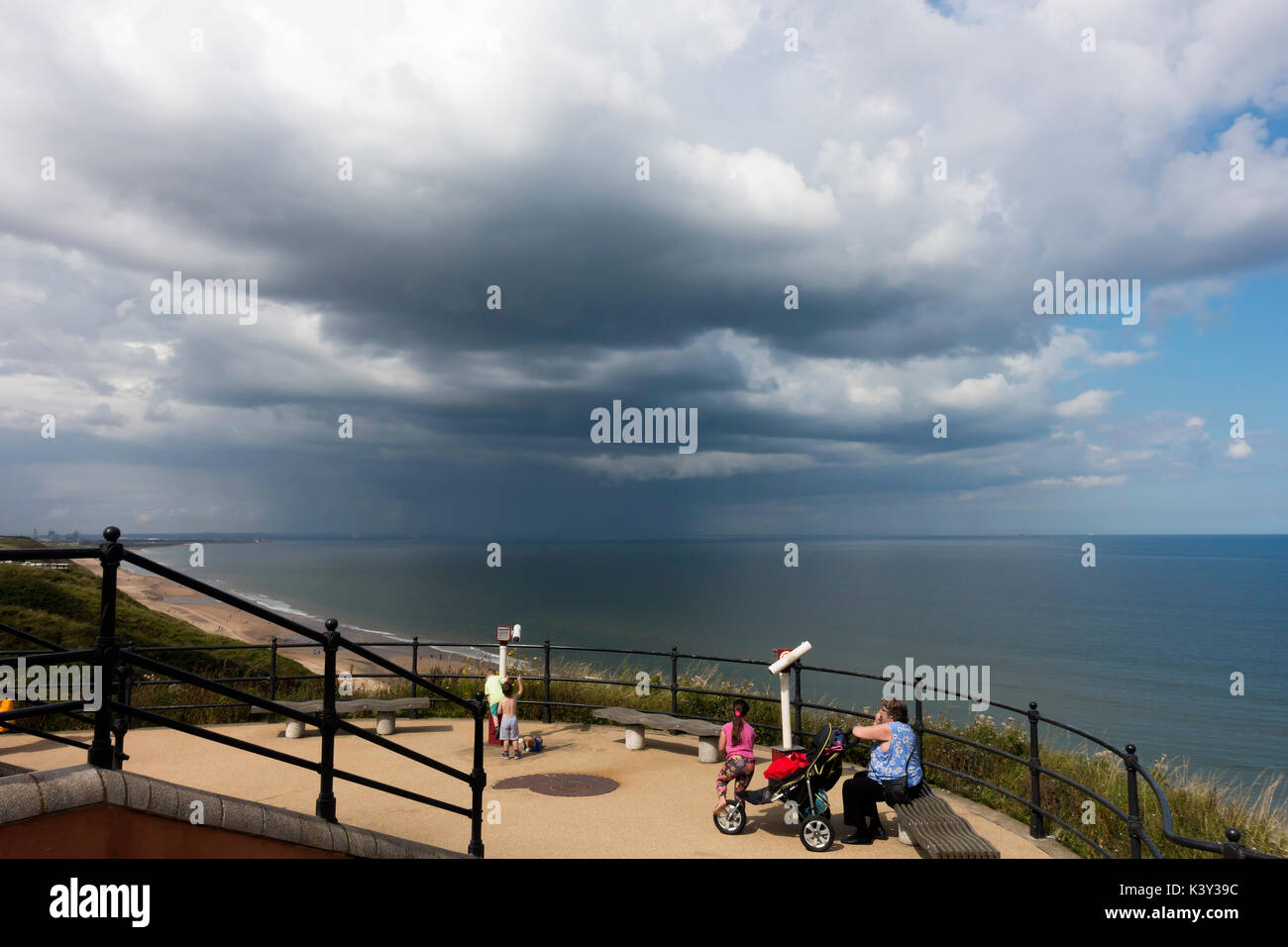 Mother and children on the cliff top at Saltburn North Yorkshire with a ...