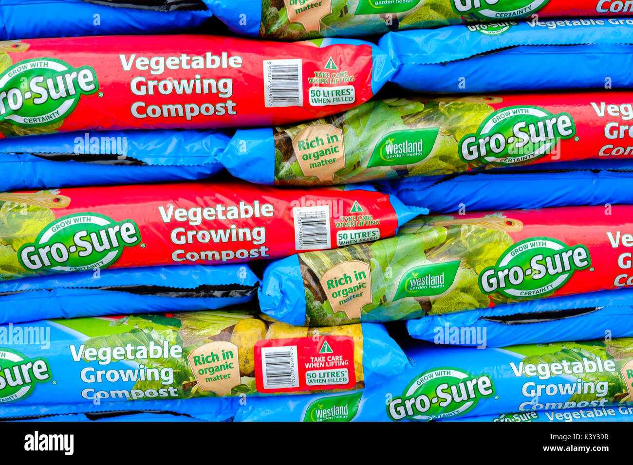 A stack of extra large Grow Sure Vegetable Growing Compost in a garden ...