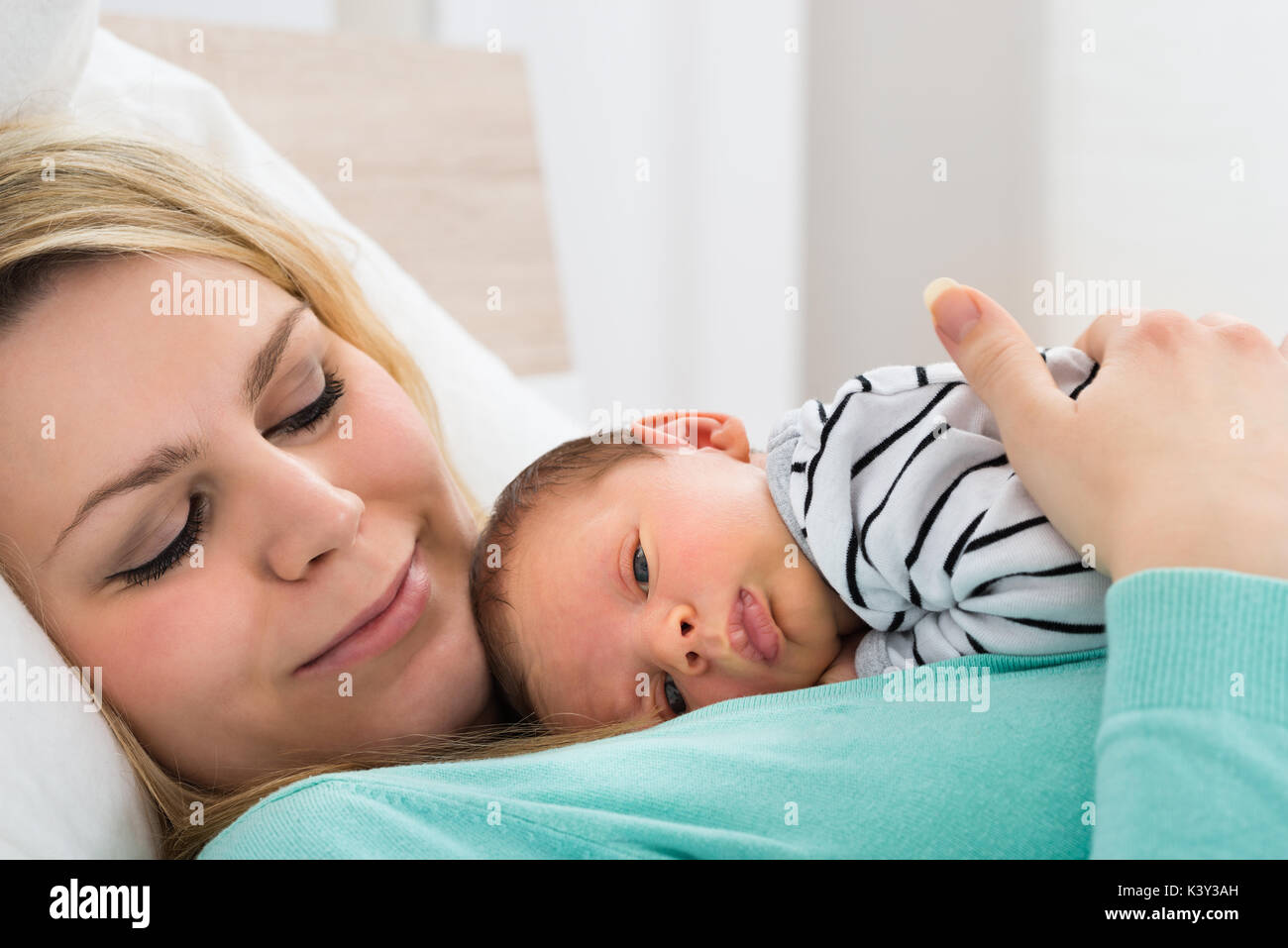 Mother holding newborn baby chest hi-res stock photography and images ...