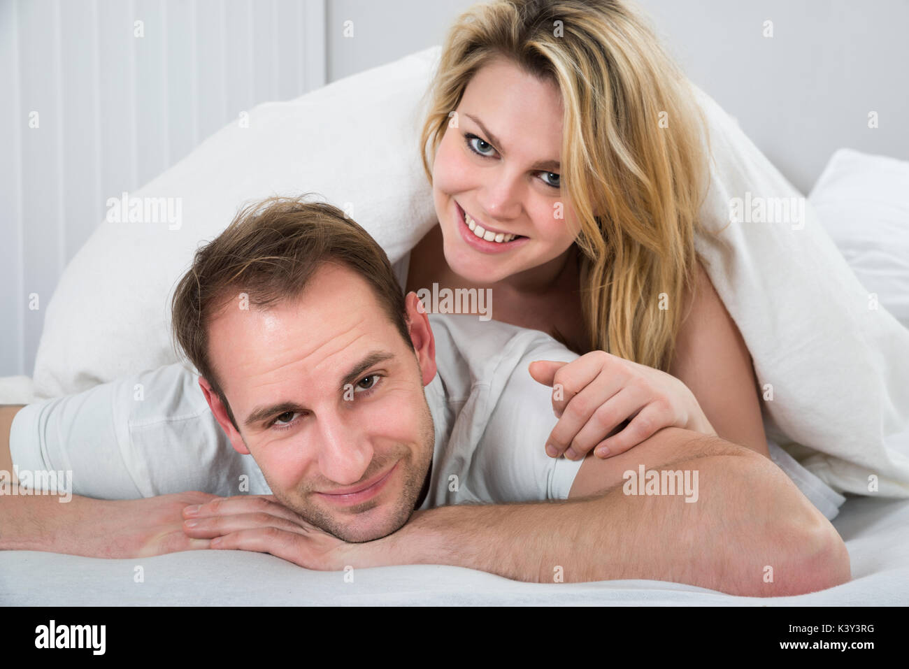 Woman looking man lying on hi-res stock photography and images - Alamy