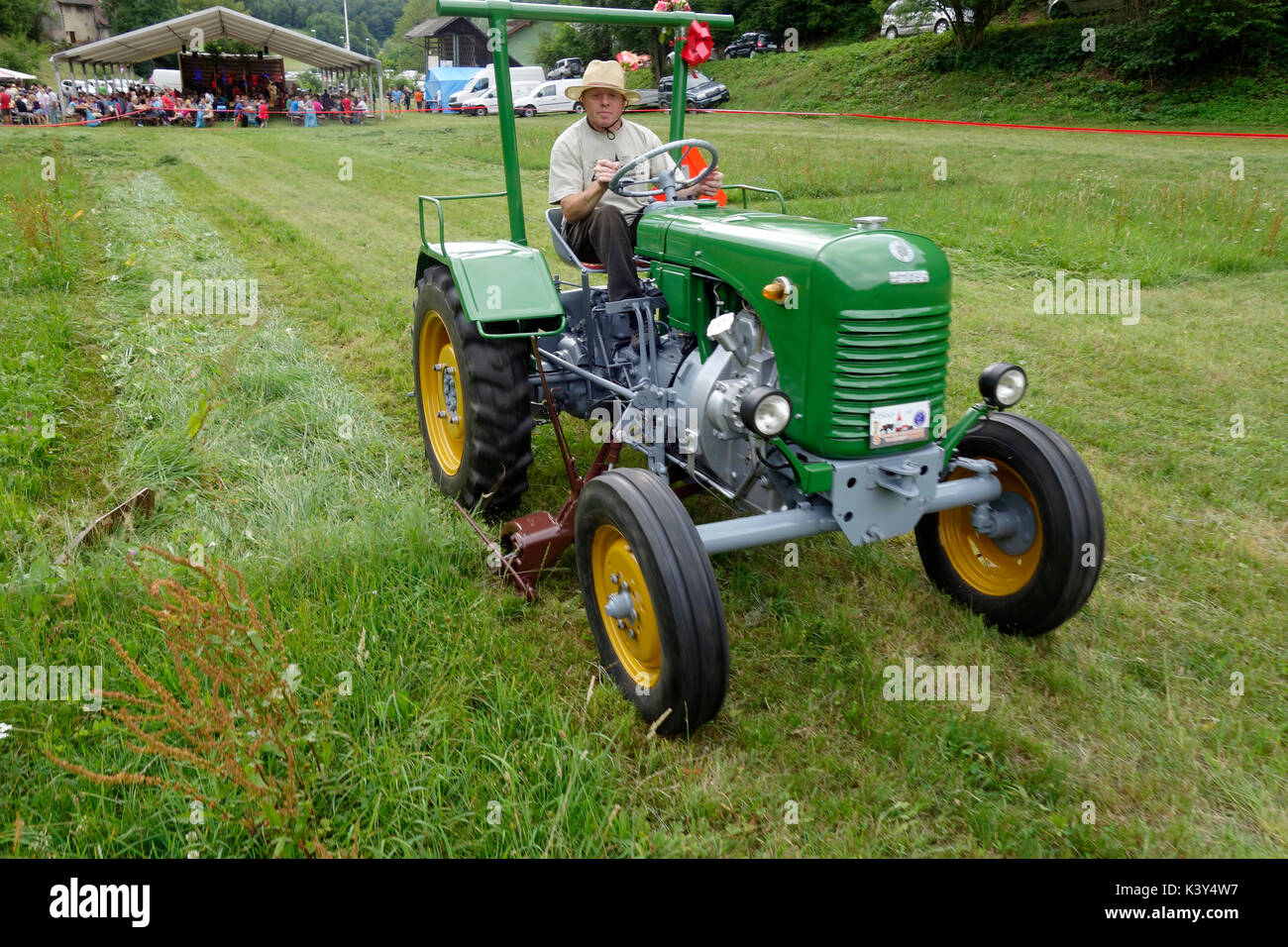 A vintage tractor, Steyr Daimler Puch from 1950es demo with side ...