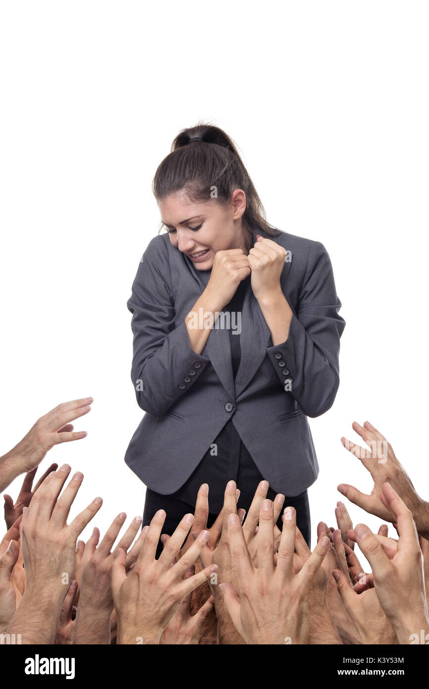 business woman being pulled down by hands all around her Stock Photo ...