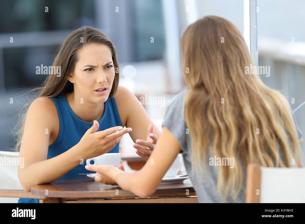 Two friends talking serious hi-res stock photography and images - Alamy