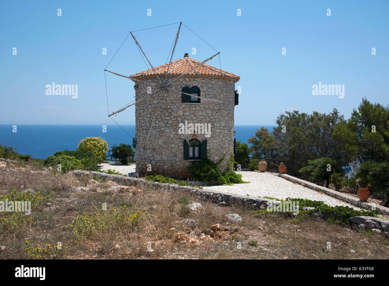 Stone windmill house at Skinari, on the northern tip of Zakynthos, in ...