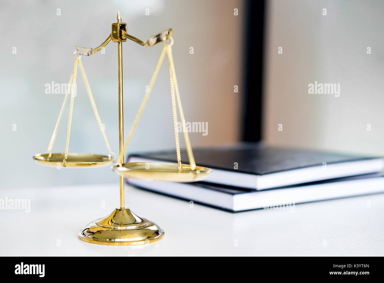 Law scales or golden weight and legals books on table. Symbol of ...