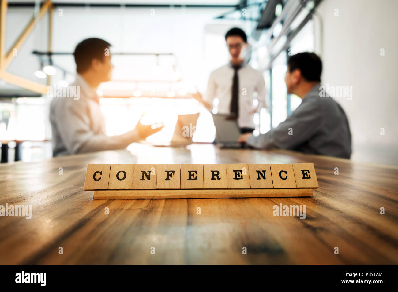 Conference word on wood table with Business team work discussion ...
