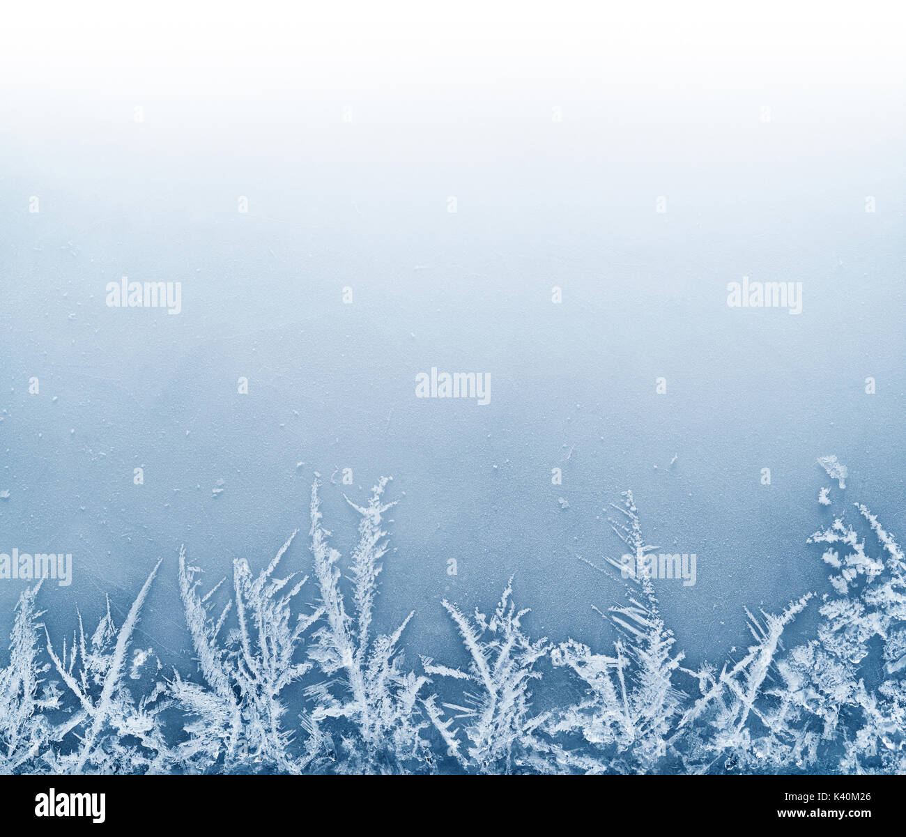 Frost crystal border on ice - Christmas background Stock Photo - Alamy