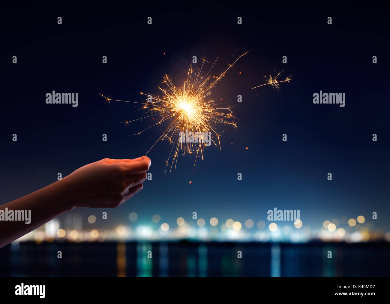Hand holding burning sparkler hi-res stock photography and images - Alamy