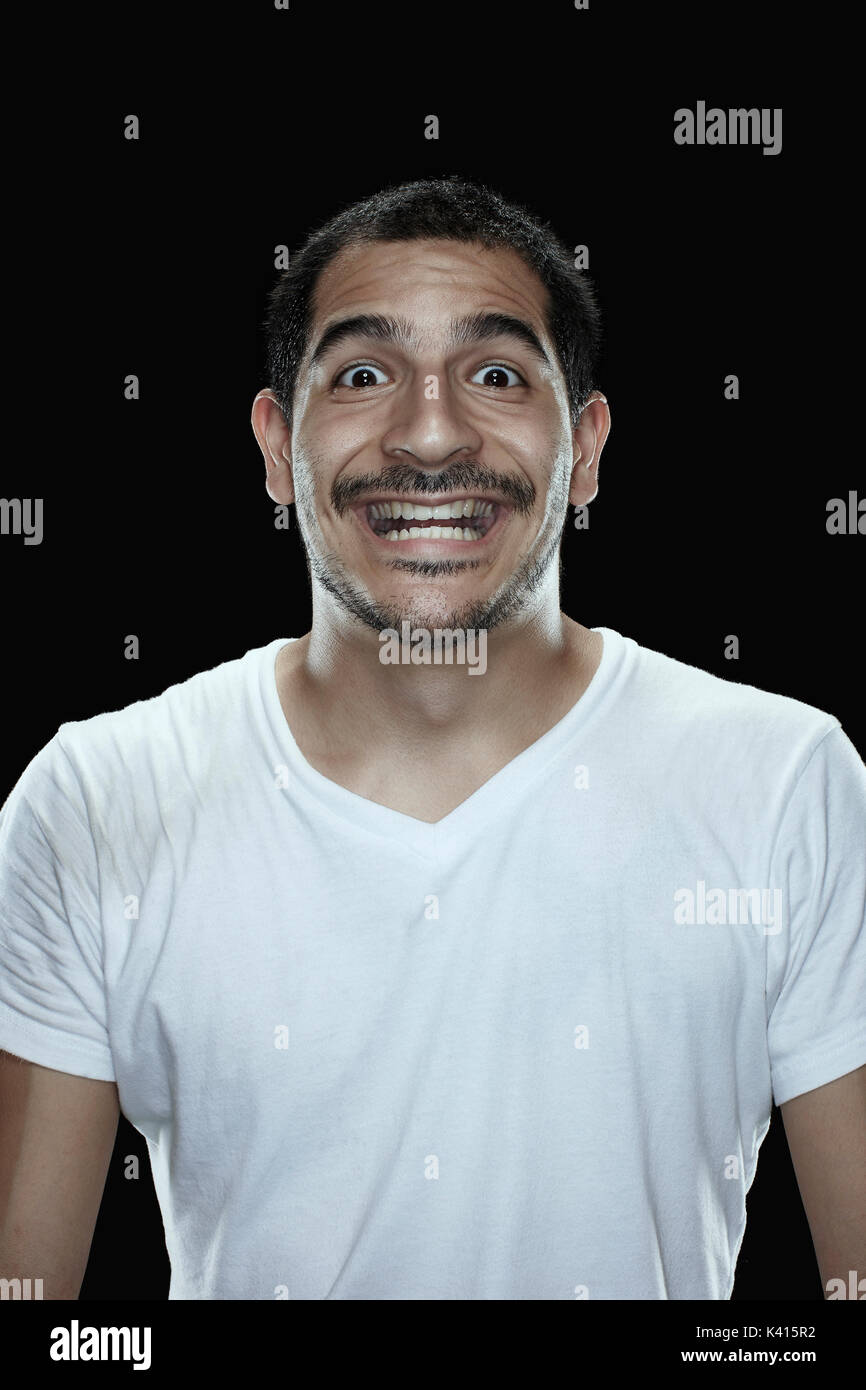 Portrait of excited man smiling Stock Photo - Alamy