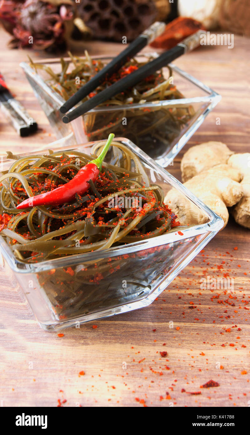 seaweed and spices, chopsticks, on an open wooden table, selective ...