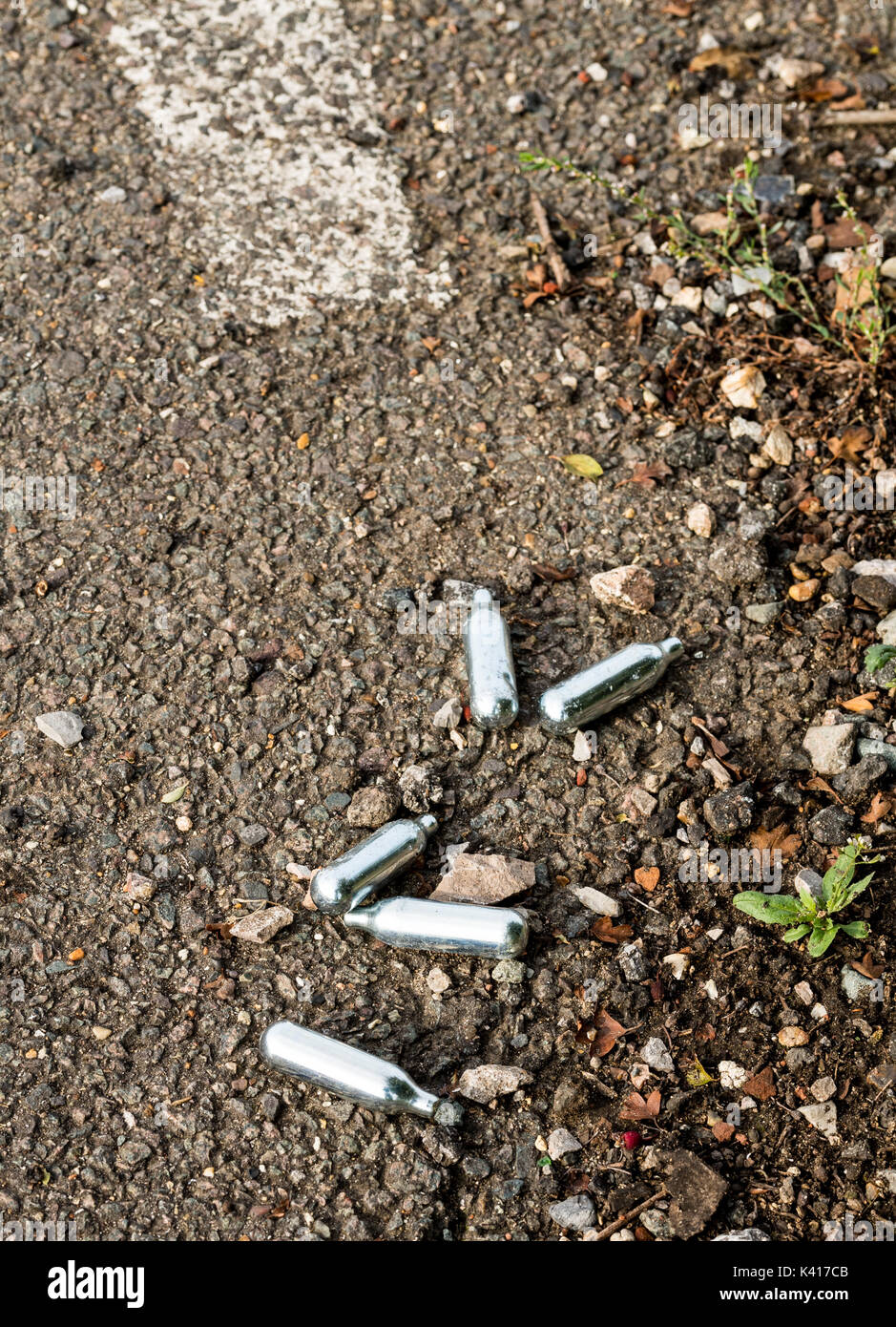 Nitrous Oxide whippits on urban street Stock Photo - Alamy