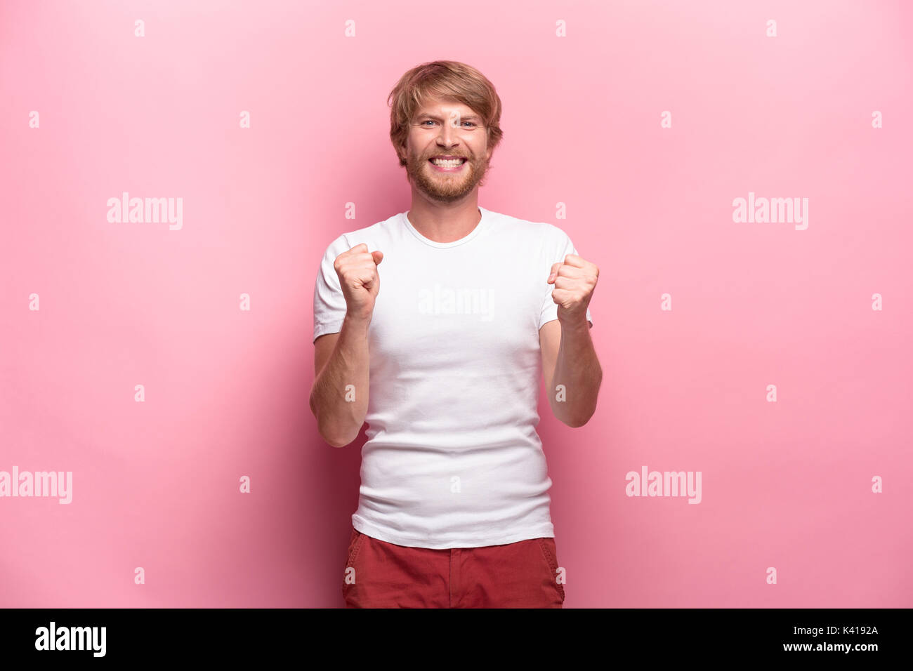Portrait of young man with happy facial expression Stock Photo - Alamy