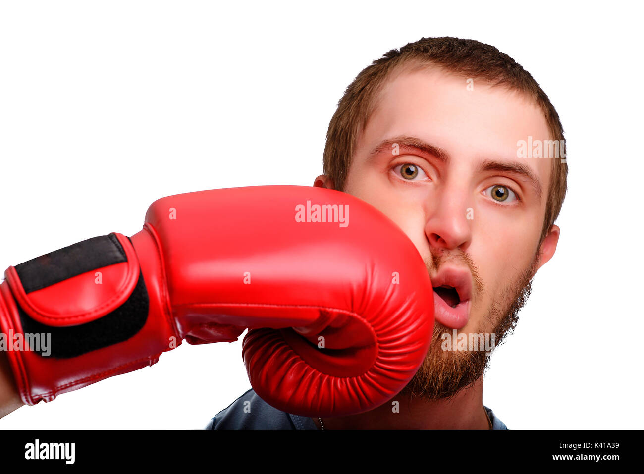 A young sports man-boxer poses to the camera. Man got a punch to the ...