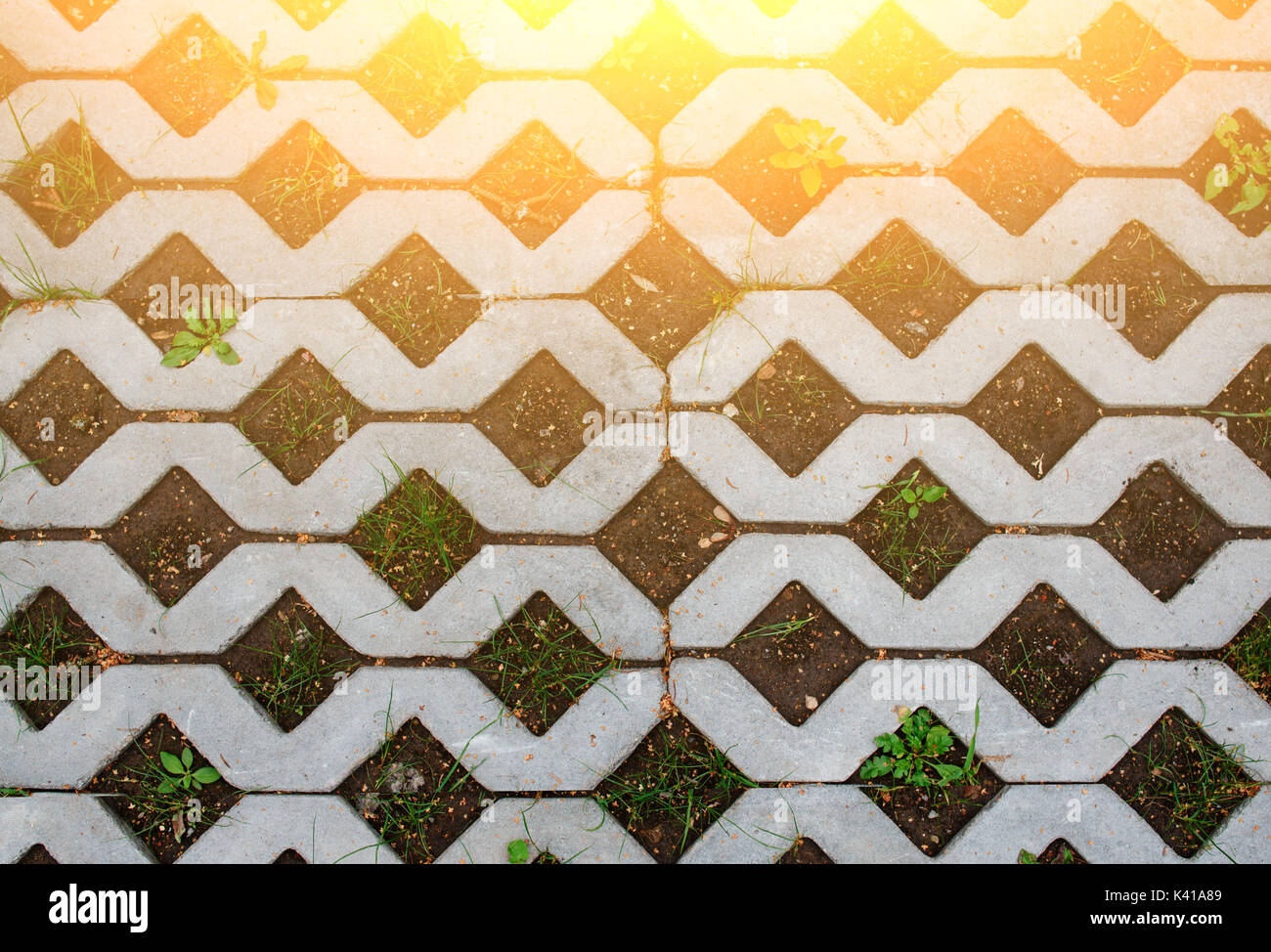 The texture of a concrete gray eco parking made of pavement, arranged ...
