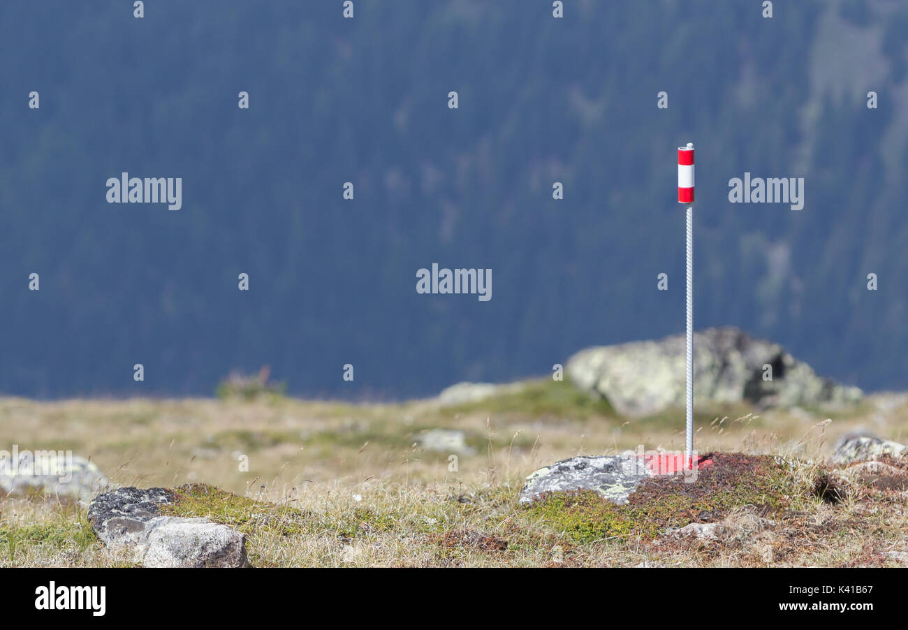 Walking path sign in Austria, flag painted on a pole Stock Photo - Alamy