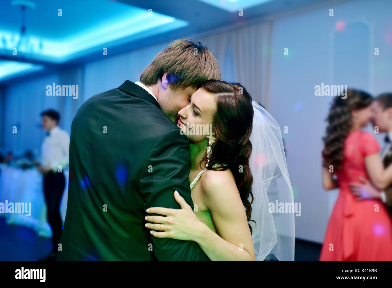 Wedding couple in the restaurant is dancing Stock Photo - Alamy